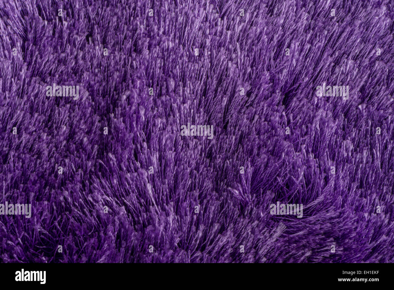 Closeup detail of purple carpet texture background Stock Photo - Alamy