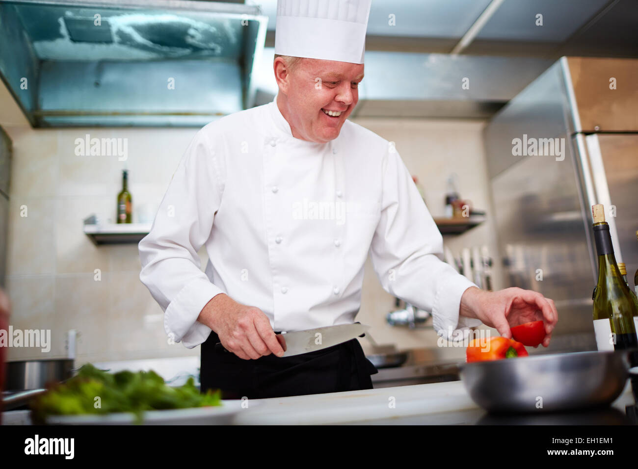 Male chef cooking vegetables Stock Photo - Alamy