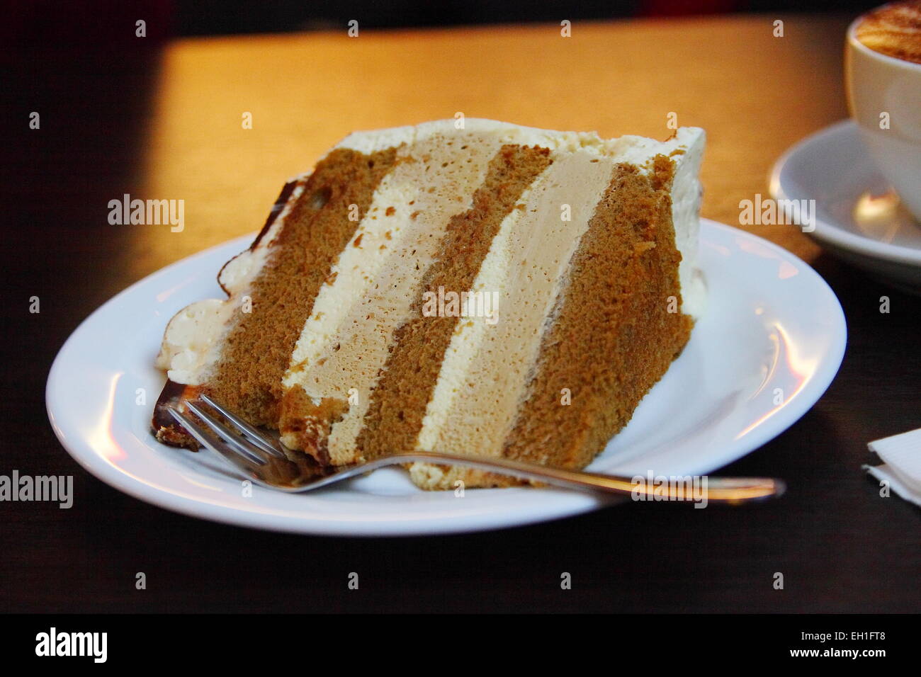Slice of Coffee cake in a plate Stock Photo - Alamy