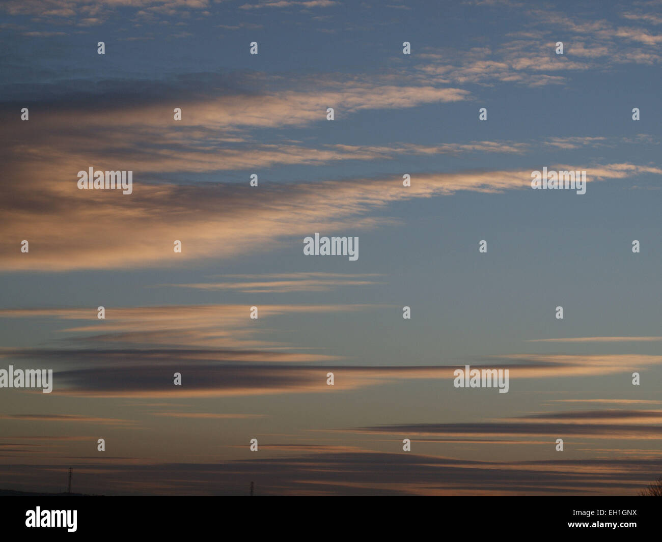 Stratus lower cloud formations in the atmosphere with the evening sun ...
