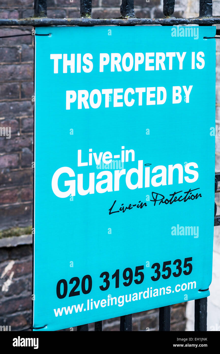 Live-in Guardians sign - London Stock Photo - Alamy