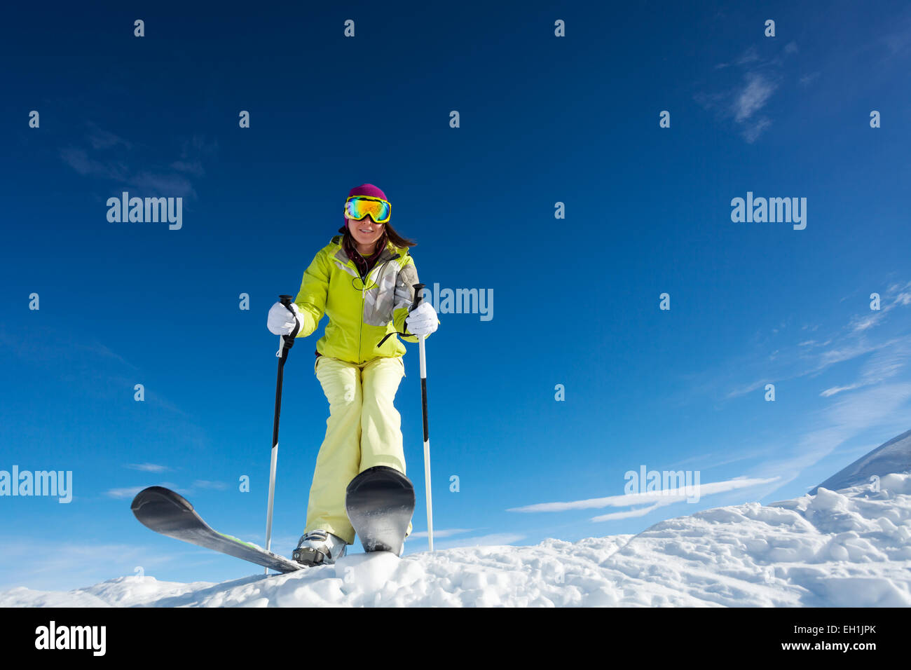 View from below of woman in mask holding poles Stock Photo - Alamy