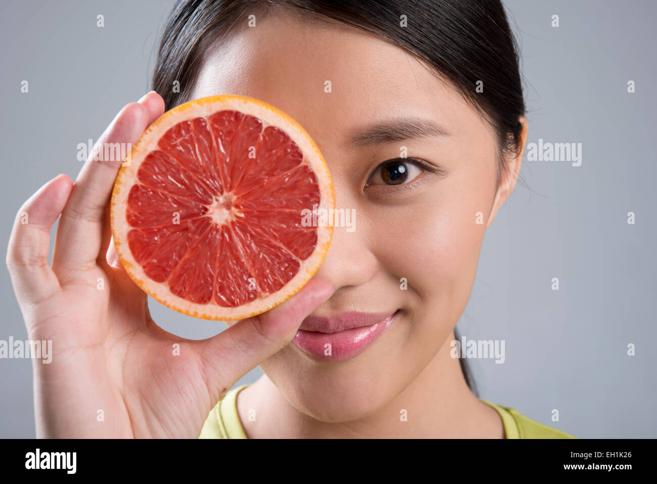 Woman pink grapefruit face hi-res stock photography and images - Alamy