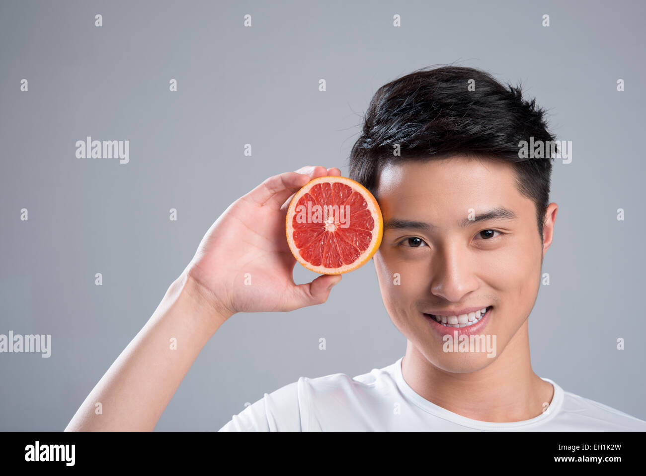 Close up man eating grapefruit hi-res stock photography and images - Alamy