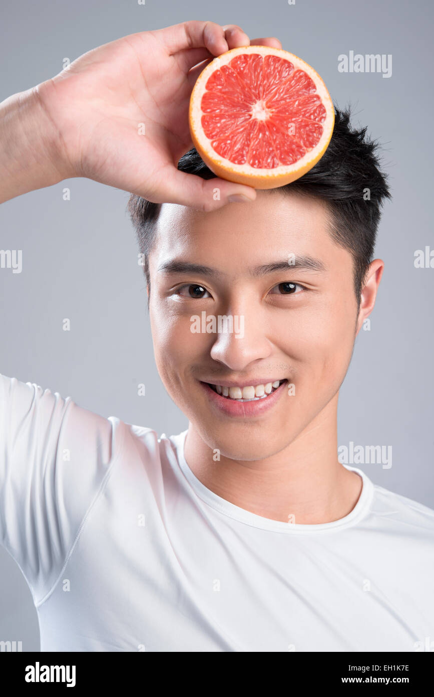 Close up man eating grapefruit hi-res stock photography and images - Alamy