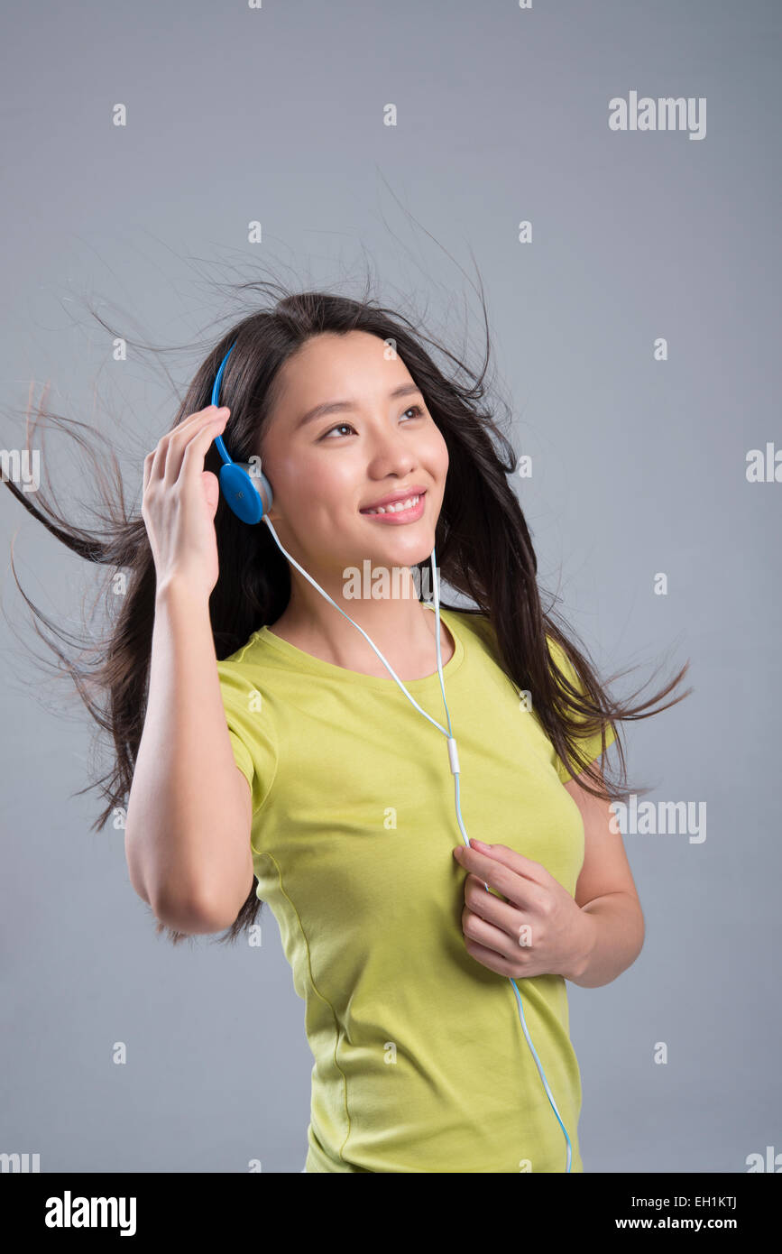 Young chinese woman headphones hi-res stock photography and images - Alamy