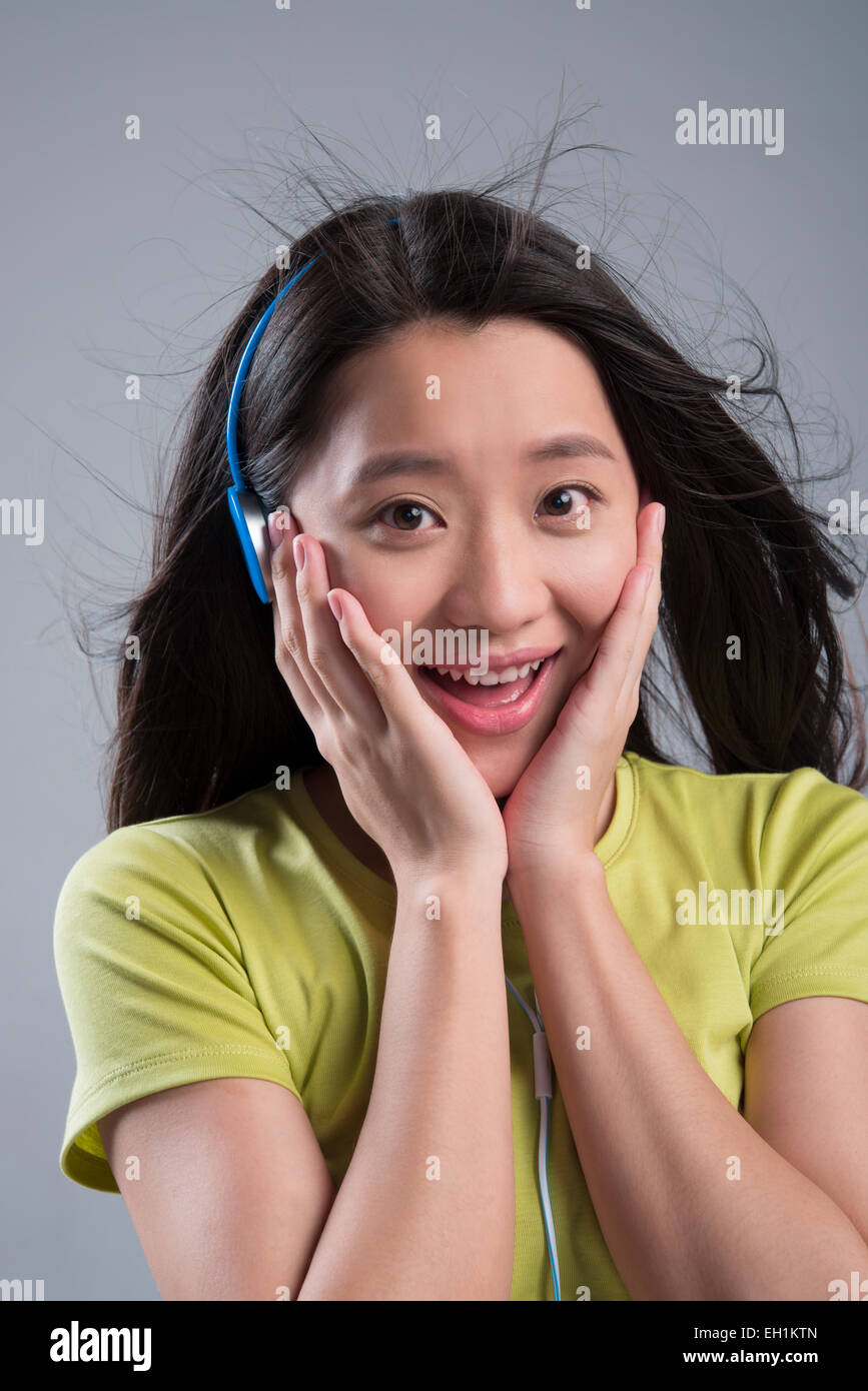 Young woman listening to music Stock Photo - Alamy