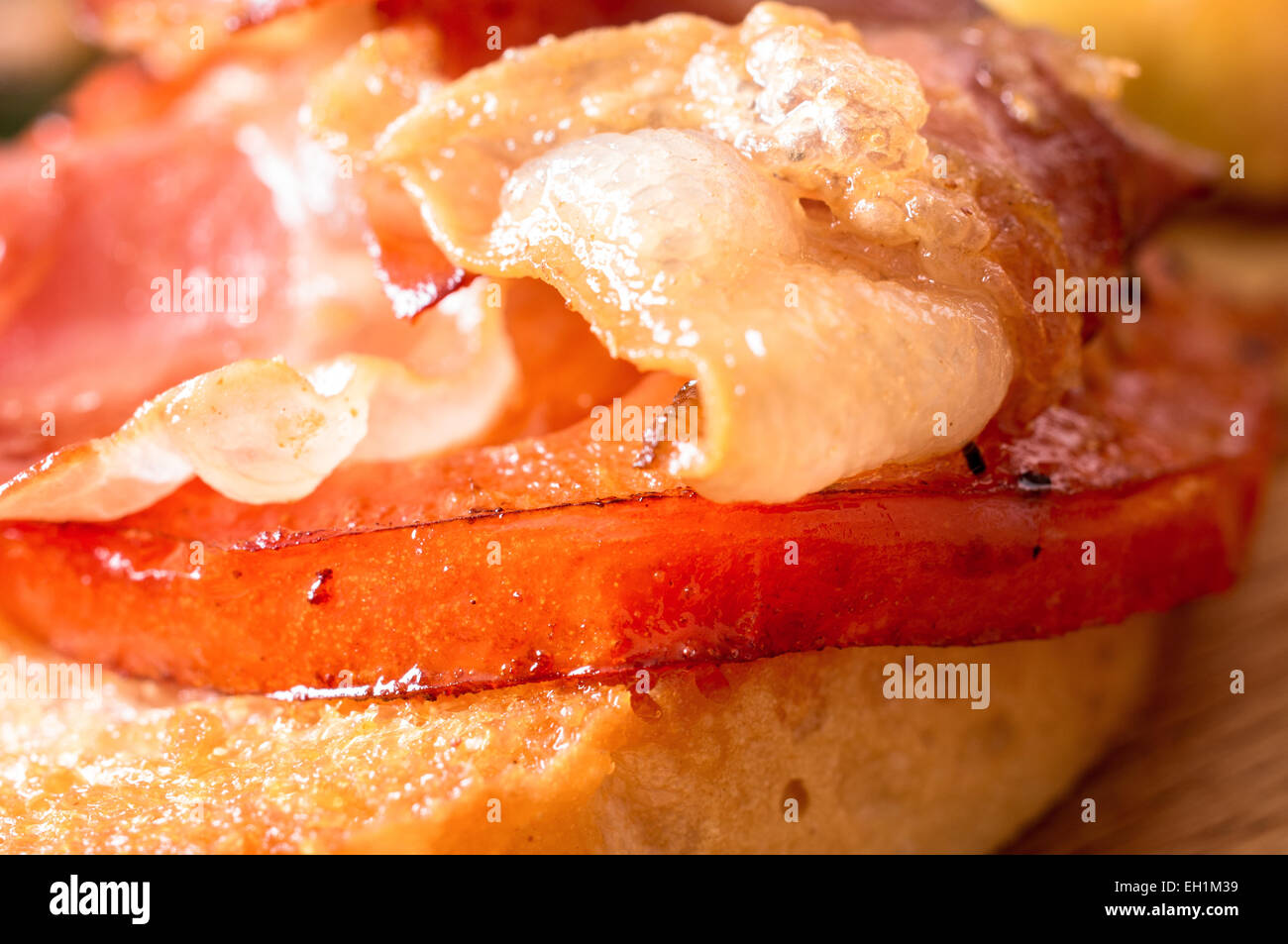 Tapas with fried bacon, tomato and spices Stock Photo - Alamy
