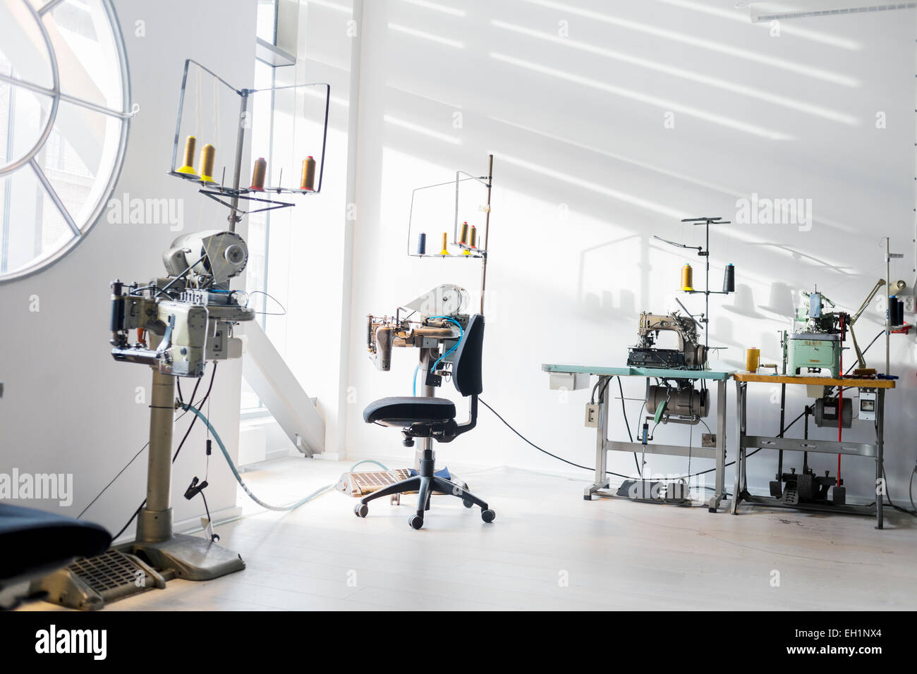 Sewing machines in factory Stock Photo - Alamy