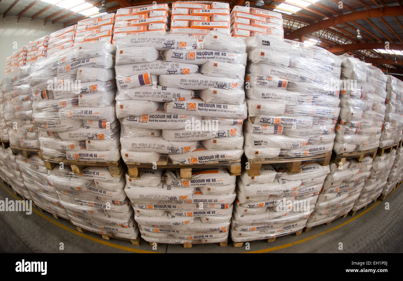 Palettes with filled bags of cement are stacked in the warehouse of ...