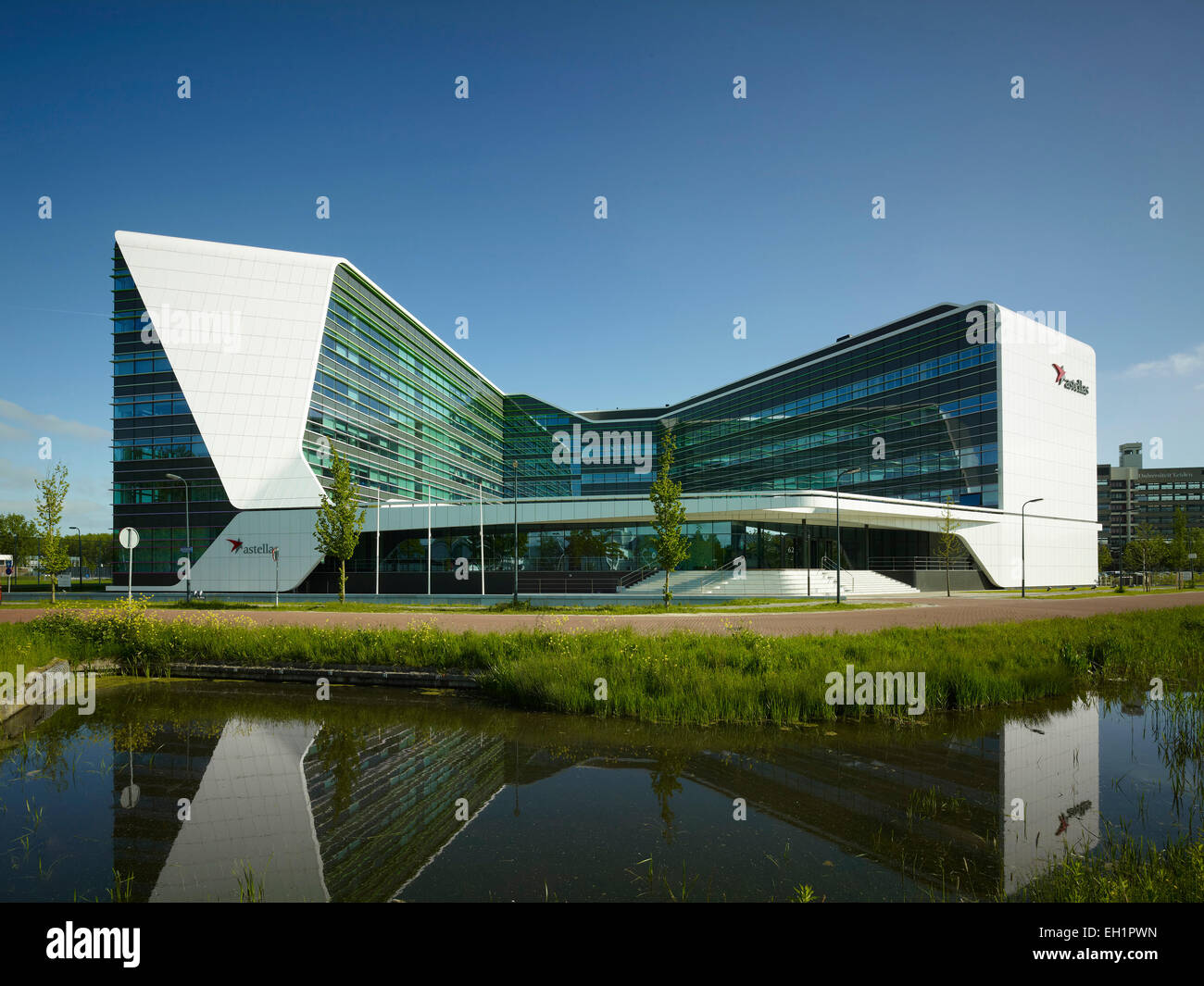 Overall front elevation of building facade across pond. Astellas ...