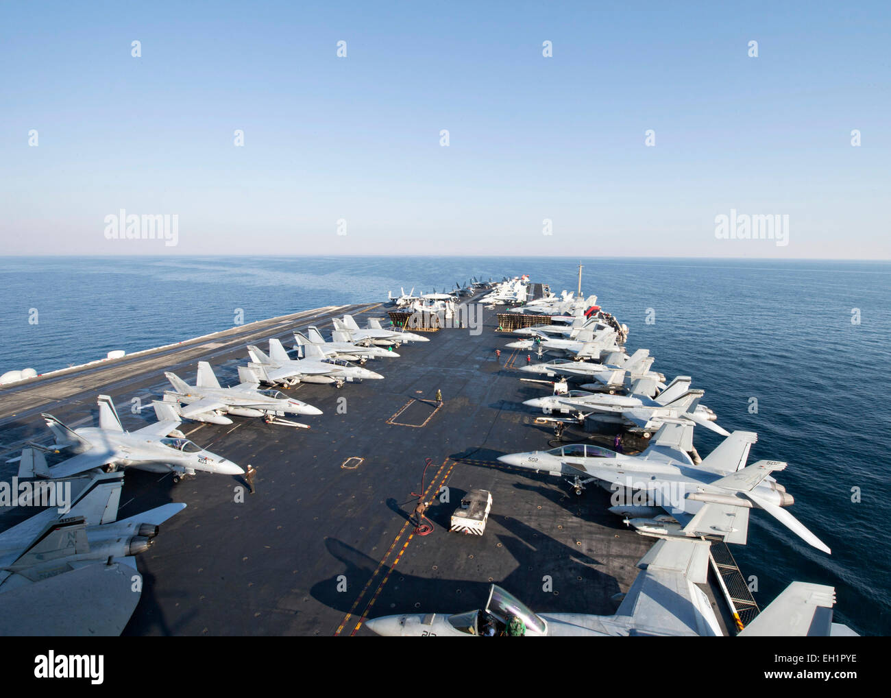 US Navy fighter aircraft line the deck of the Nimitz class super Stock ...