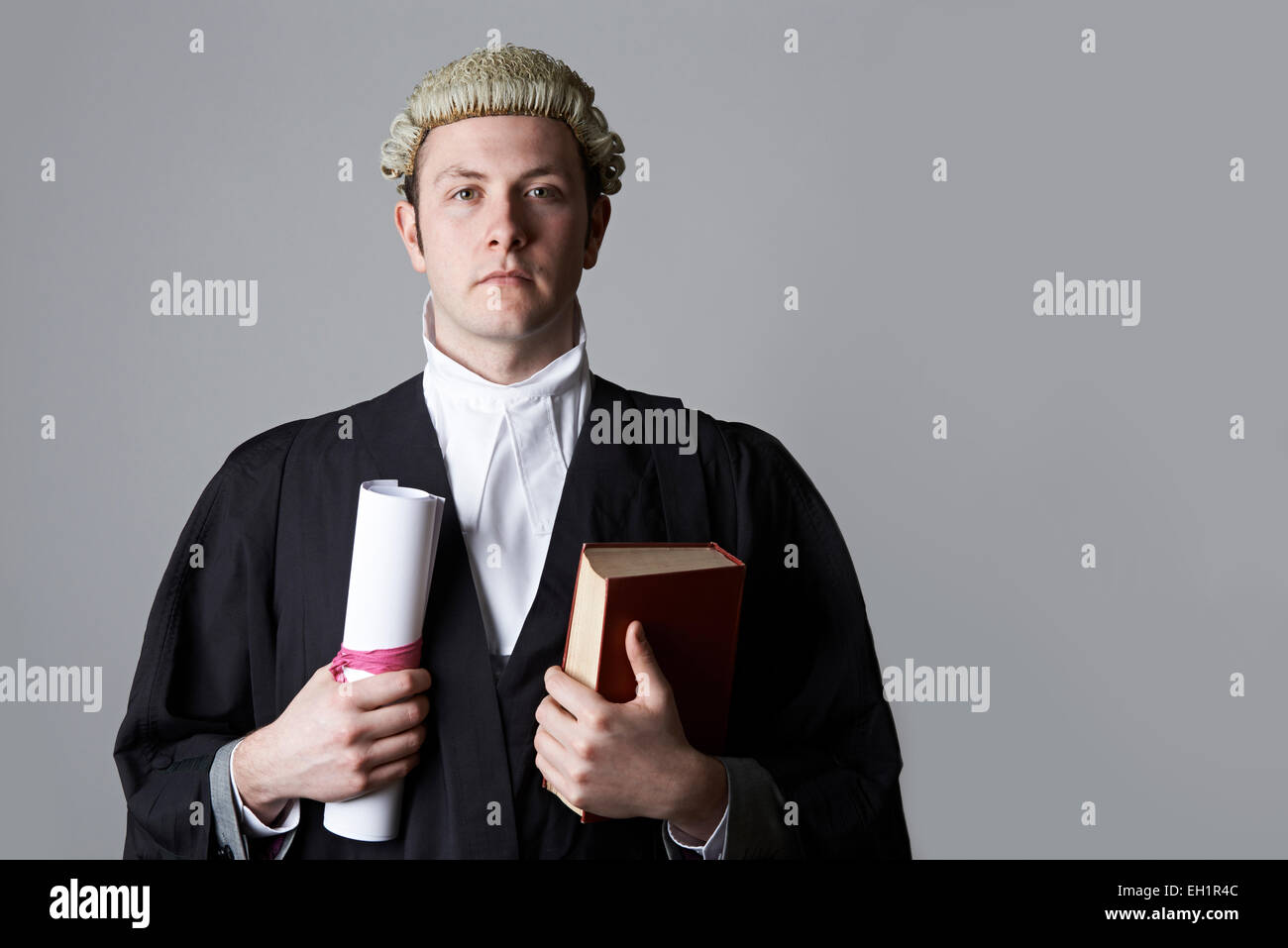 Studio Portrait Of Lawyer Holding Brief And Book Stock Photo - Alamy