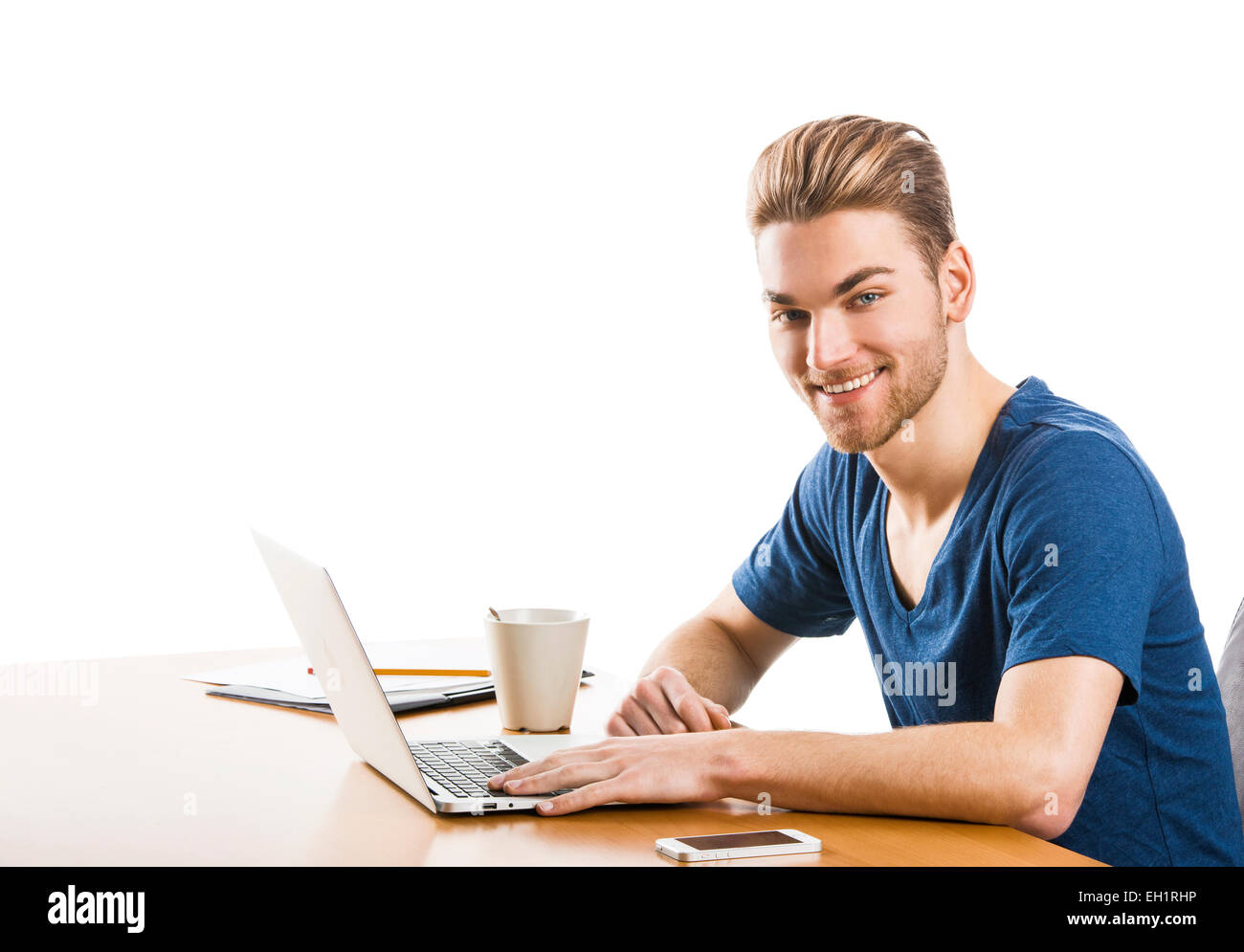 Good looking young man in the office working, isolated over white ...