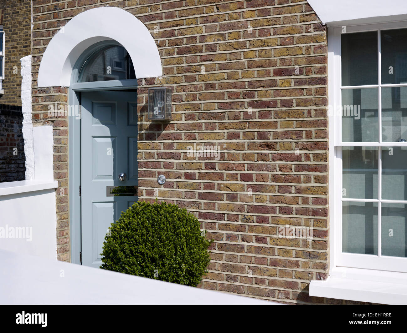 Traditional brick facade and panelled front door, residential house ...