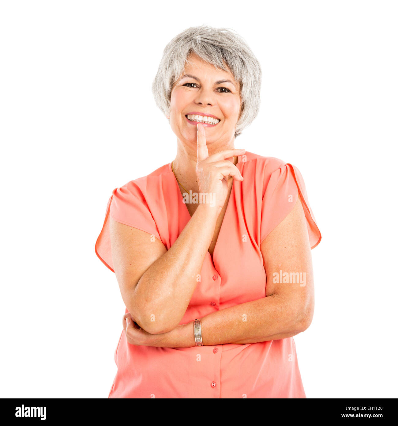 Portrait of a happy elderly woman with a thinking expression, isolated ...