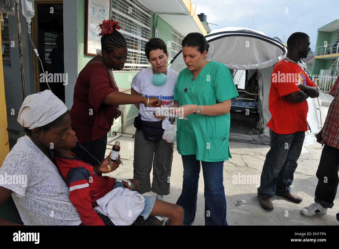 Injured earthquake victims outside the main hospital waiting for ...