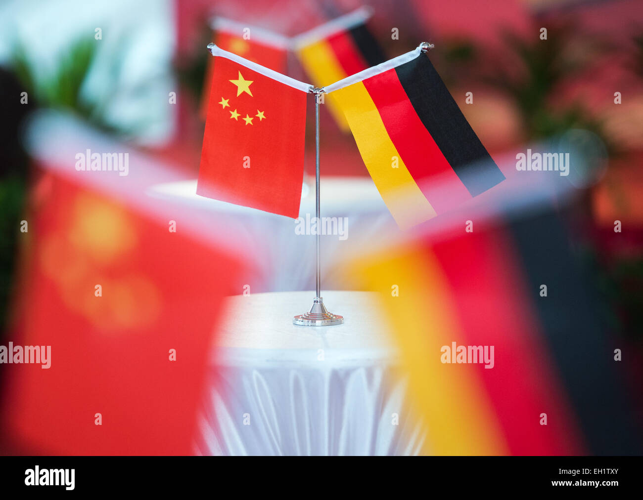 The national flags of China and Germany are on display on tables during ...