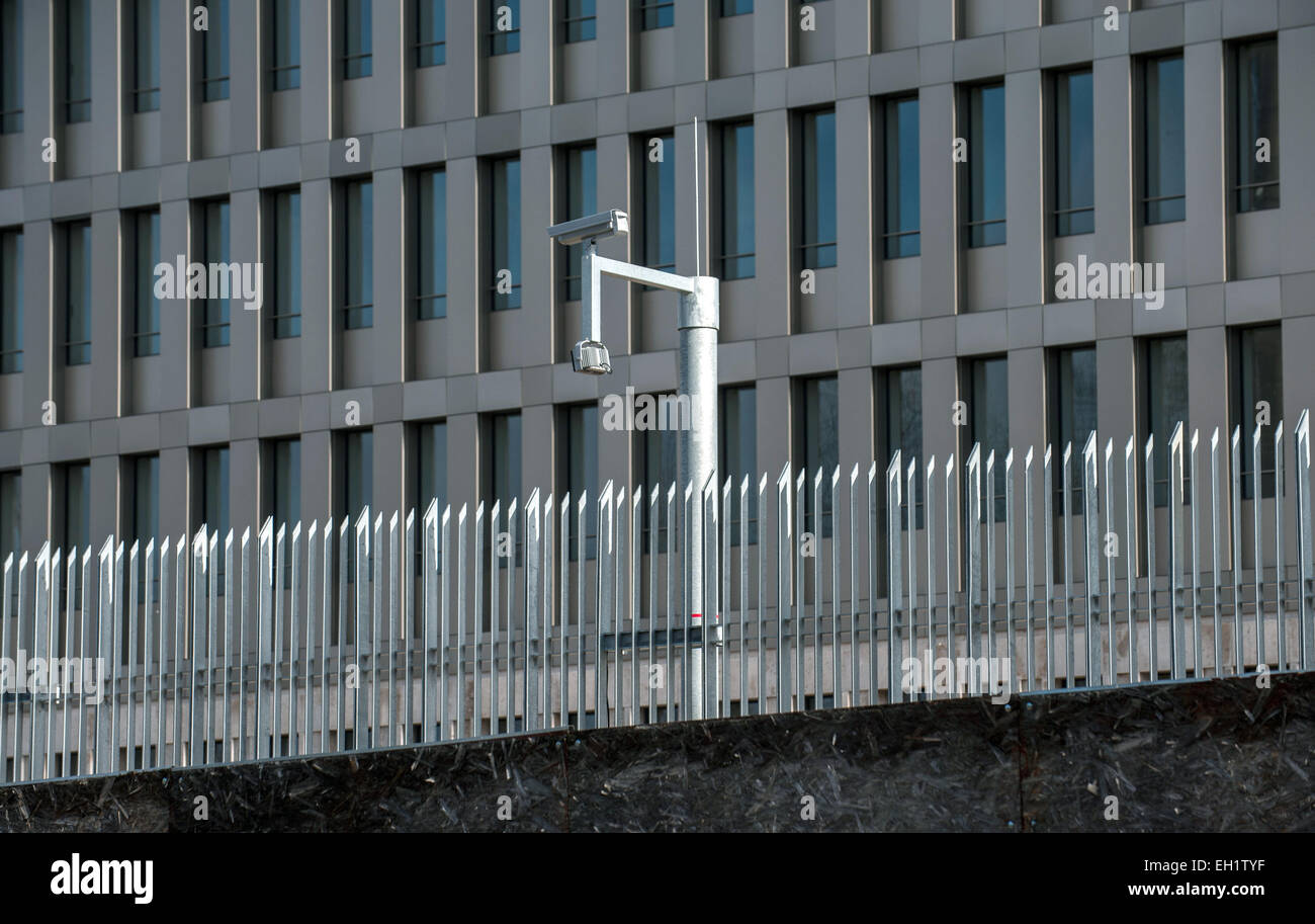 A surveillance camera and a fence are securing the new headquarters of ...