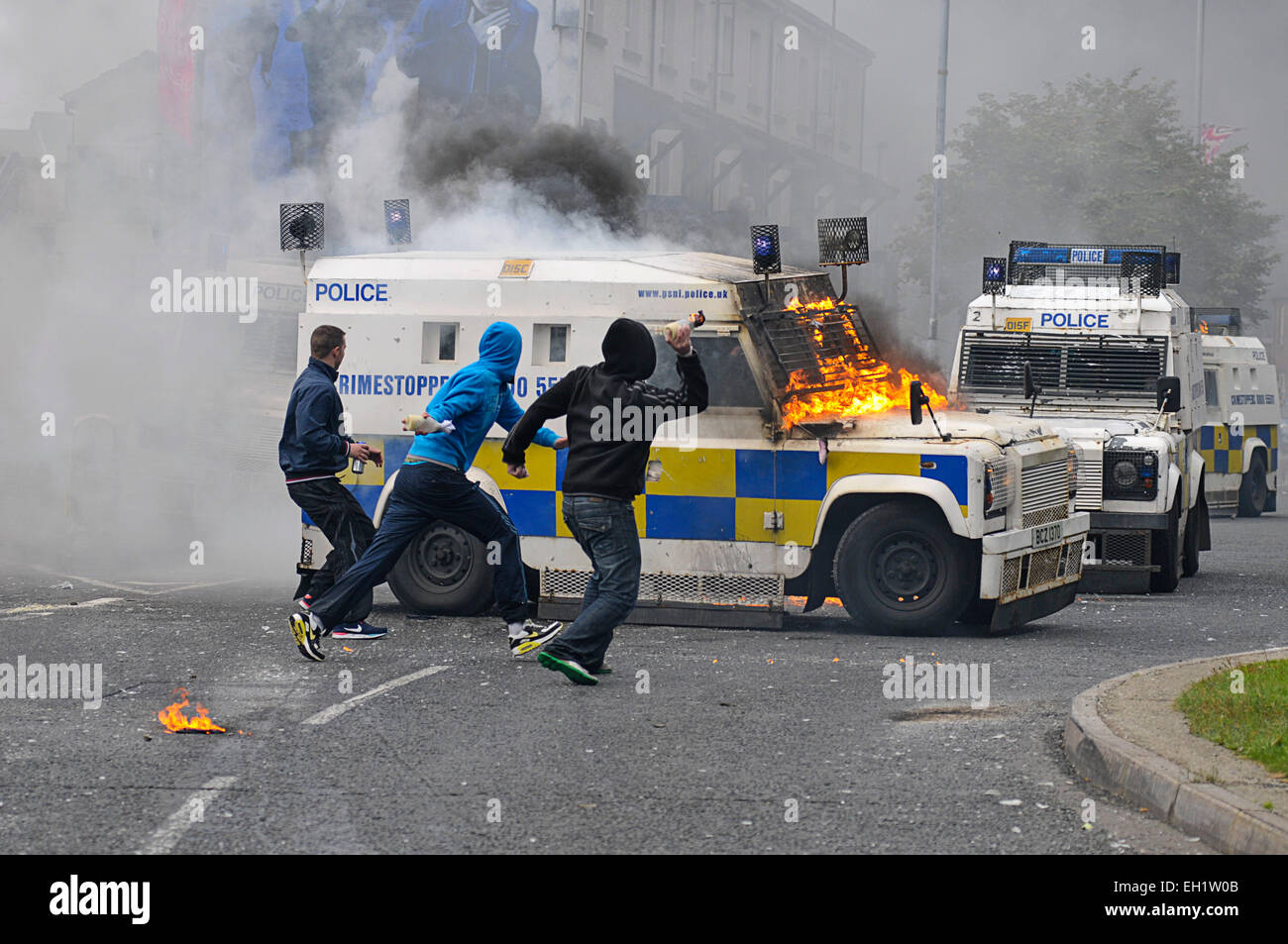 Nationalist youths throwing petrol bombs at PSNI vehicles during riots ...