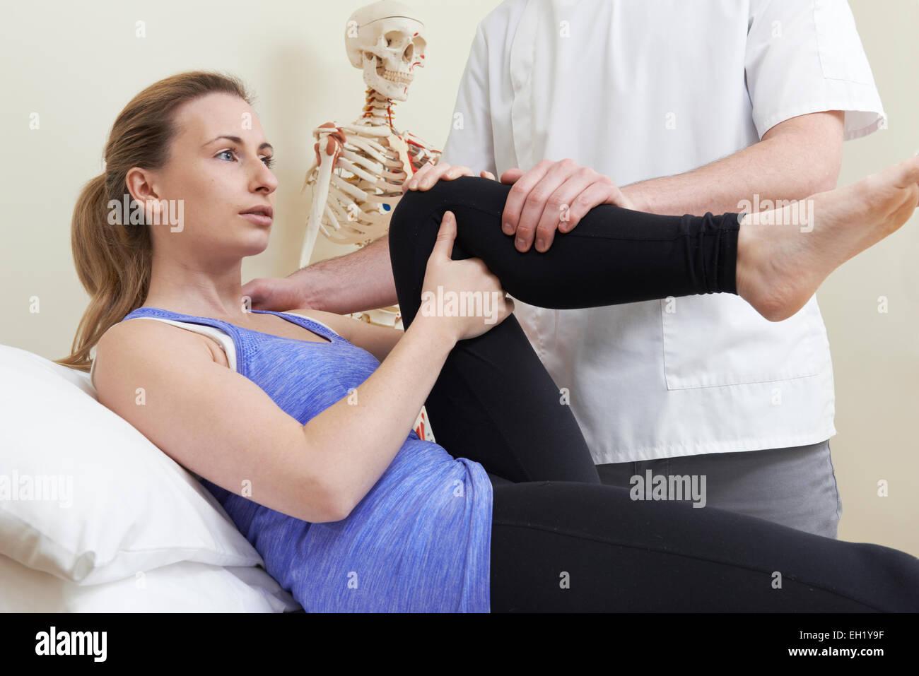 Male Osteopath Treating Female Patient With Hip Problem Stock Photo - Alamy