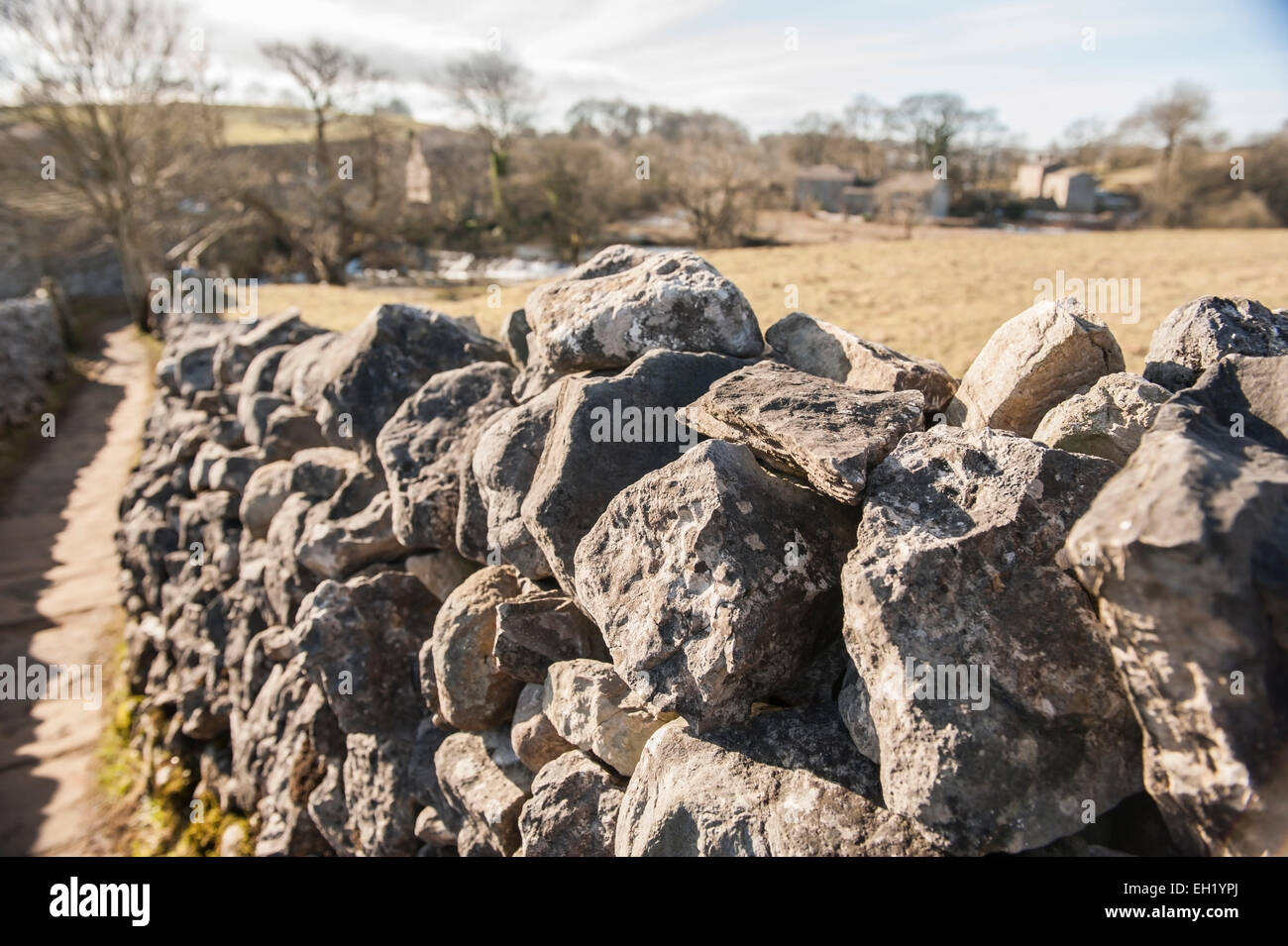 Old dry stone wall in an english countryside rural landscape scene ...