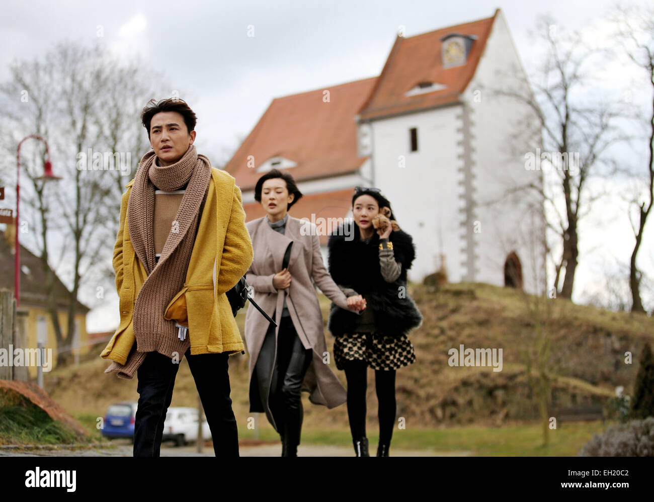Chinese actors Jian Sun (l-r), Yang Wang and Wang Xue Min walk across ...