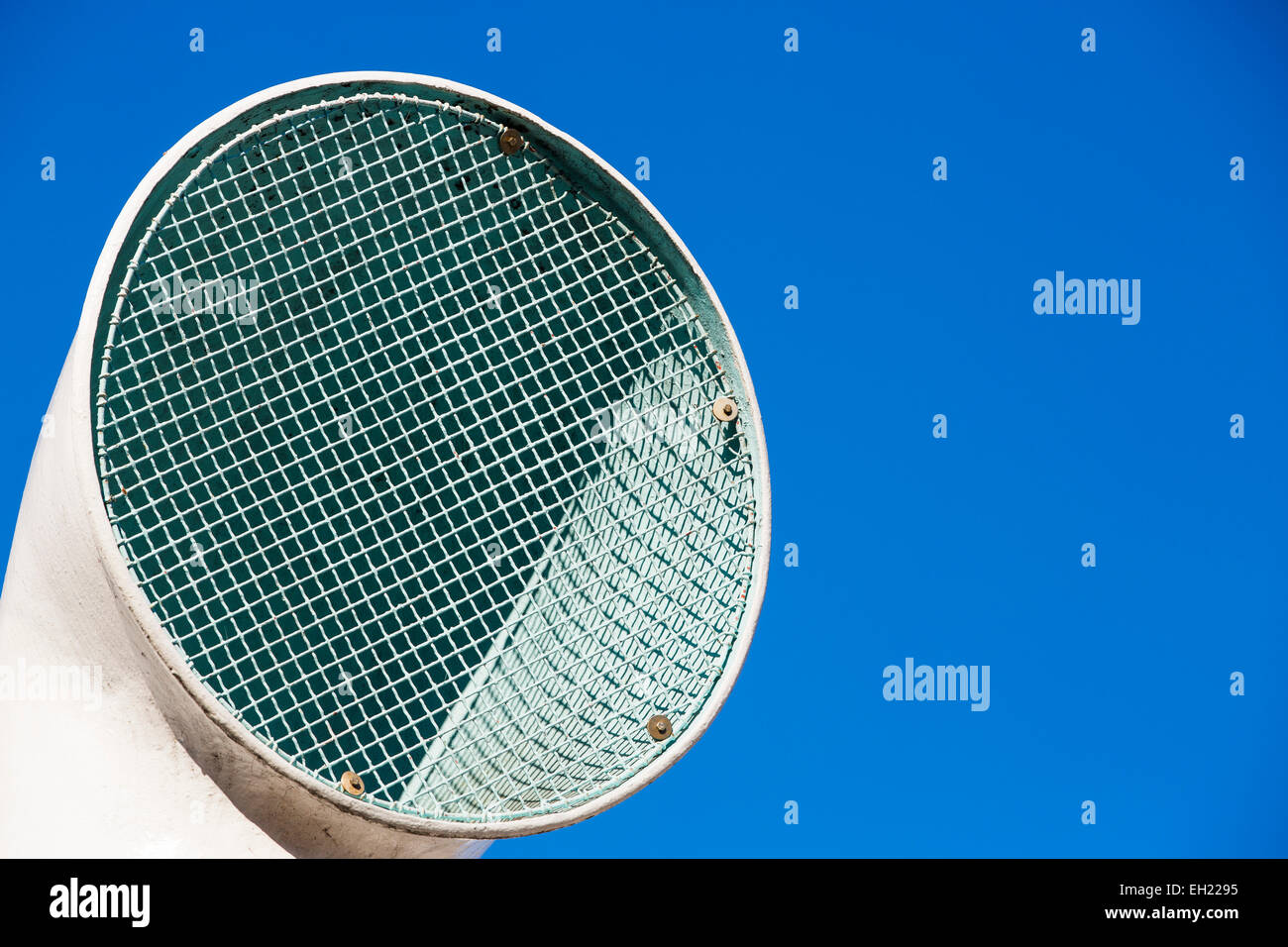 Ship funnel with metal grating against a clear blue sky Stock Photo - Alamy