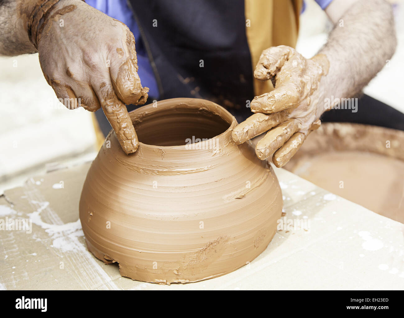 Traditional pottery, detail of a person shaping the clay Stock Photo ...