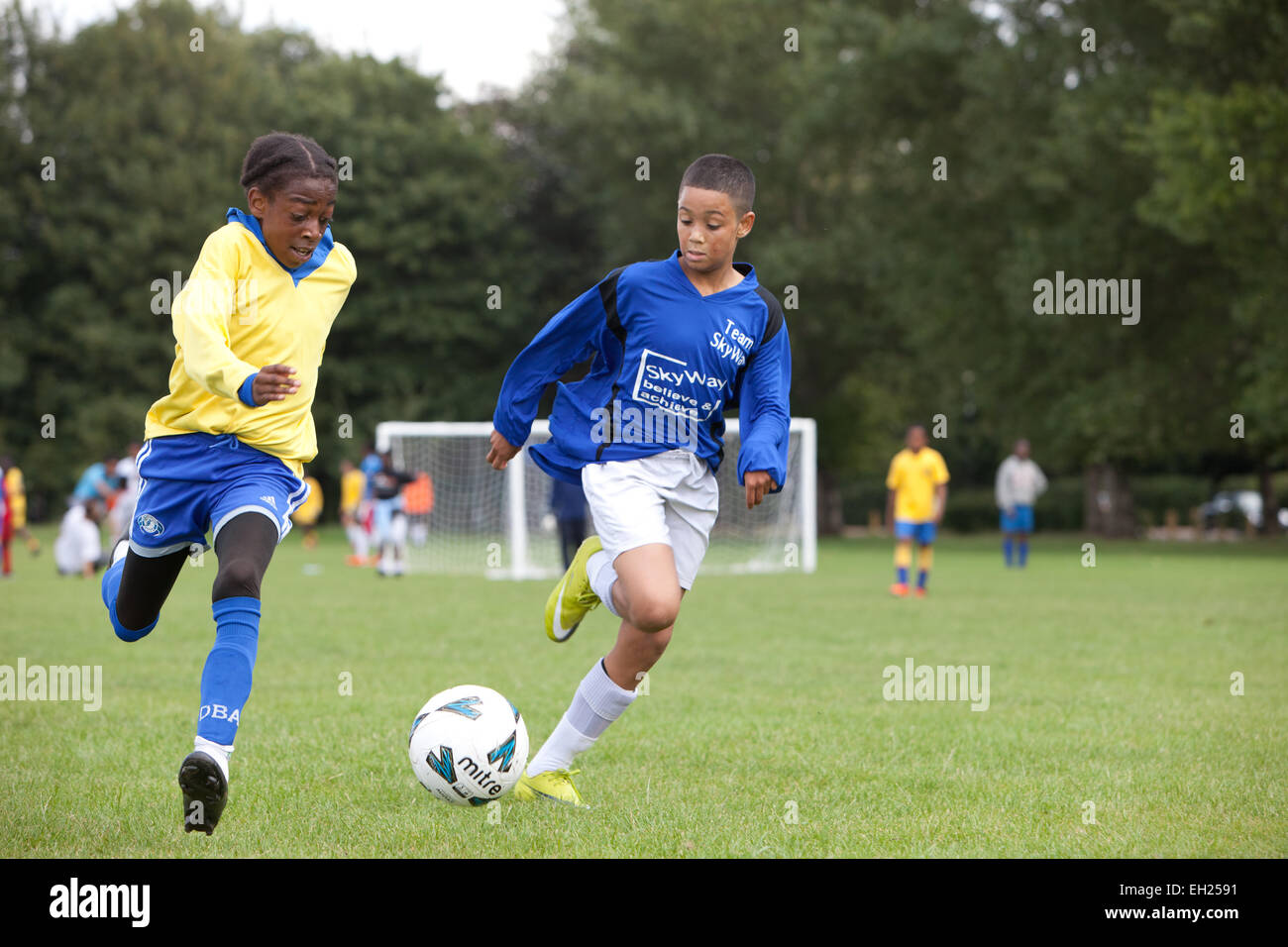 Boys playing football, Hackney Marshes, London Stock Photo - Alamy