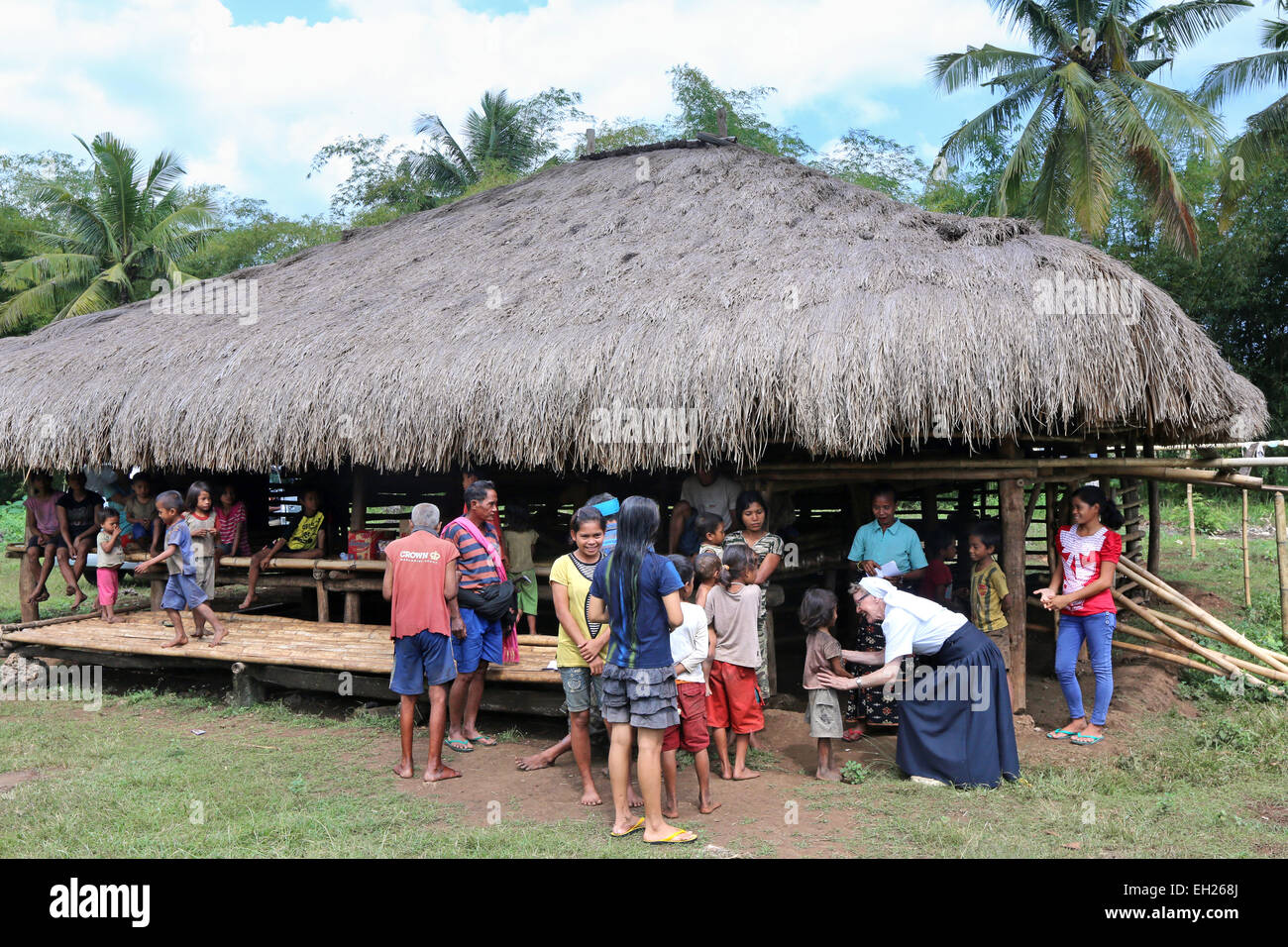 Sumbanese house in a village with traditional thatched roof, island of ...