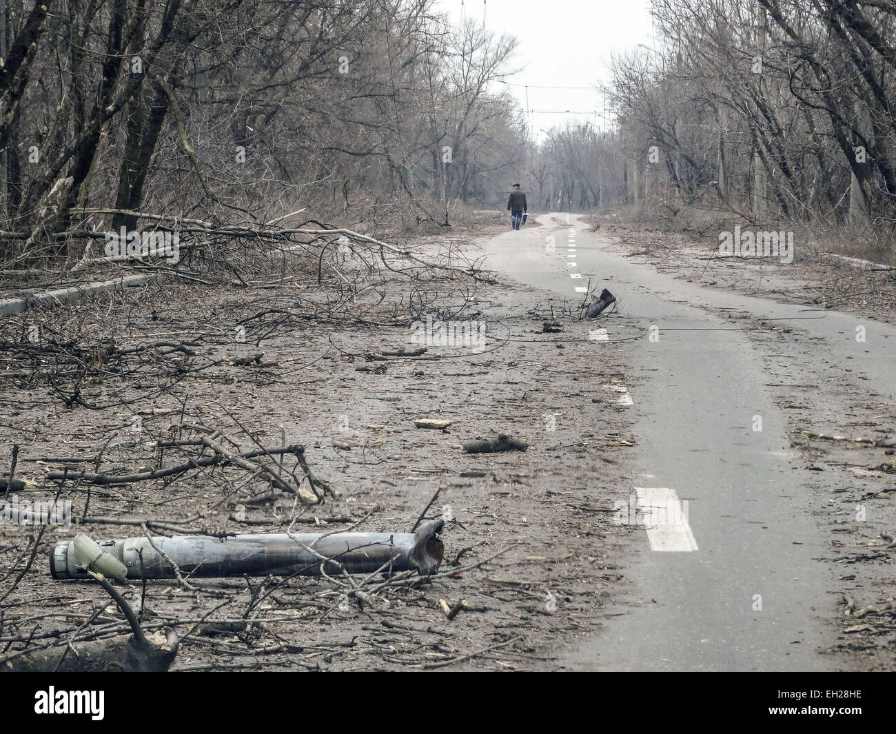 Donetsk, Ukraine. 4th March, 2015. A man walking along the road in the ...
