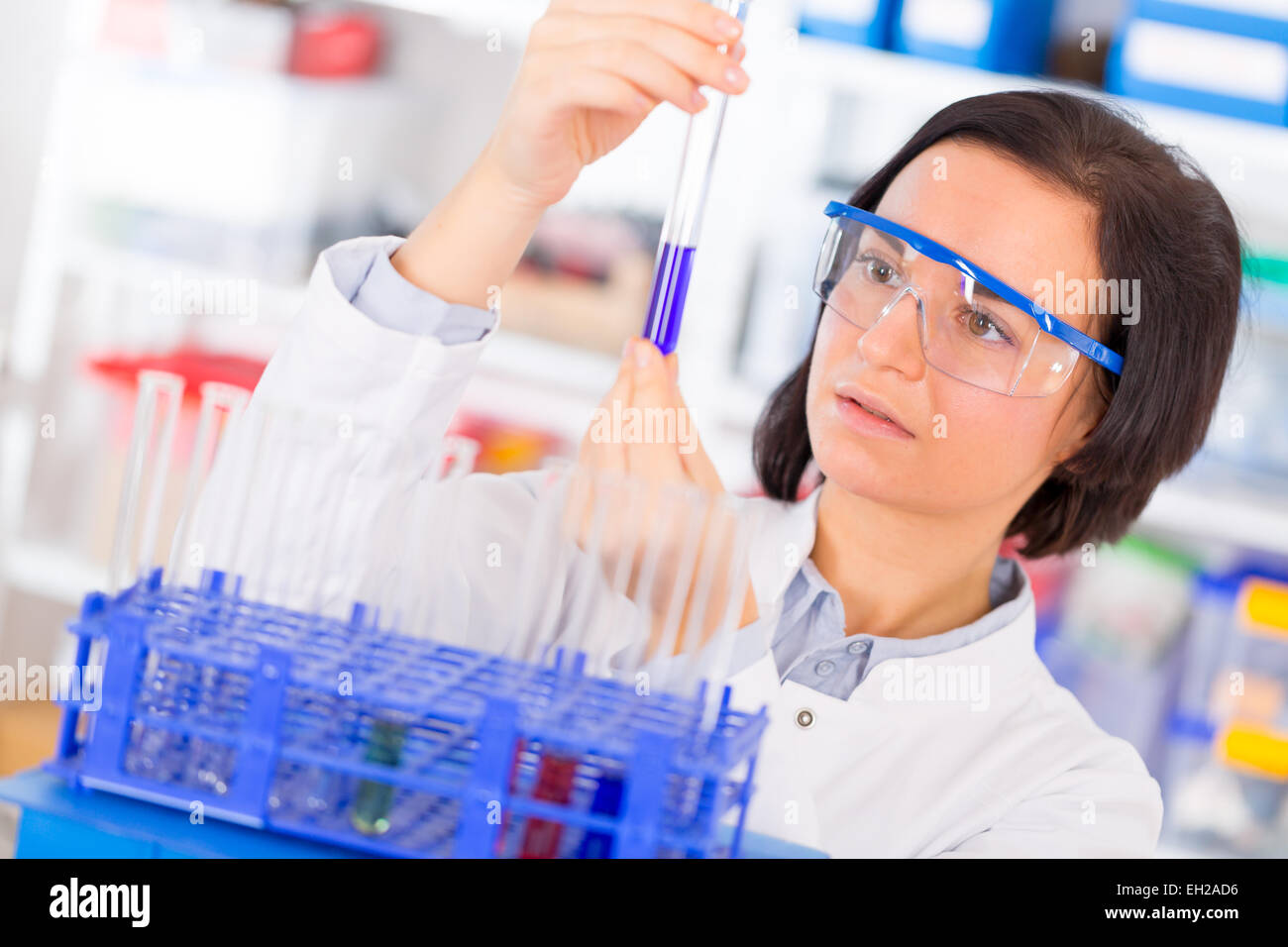 Woman with test tube Stock Photo - Alamy