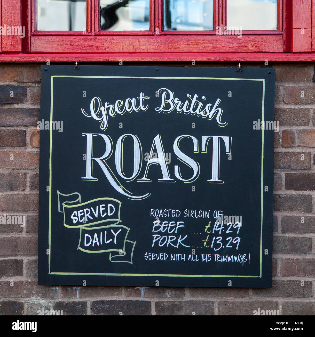 A sign on a traditional English Public House advertising their ...
