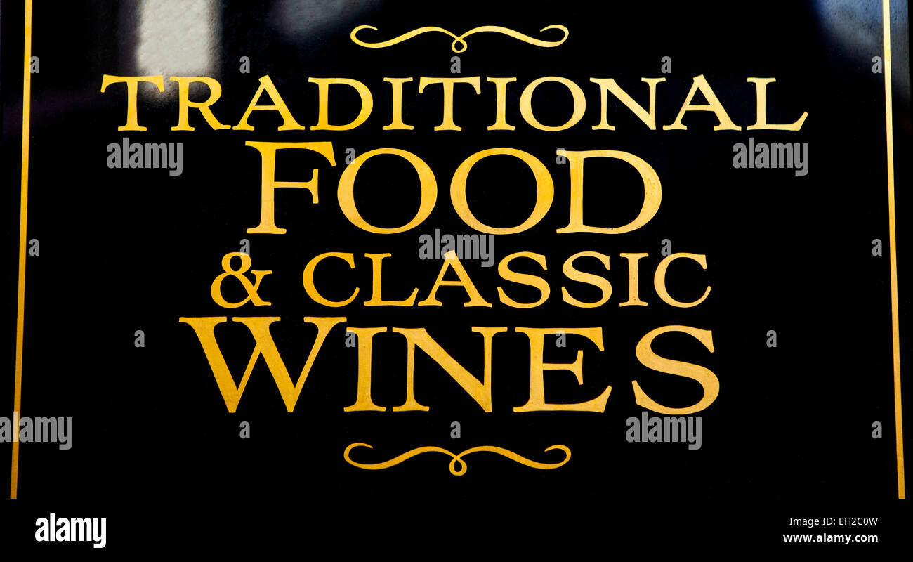 A pub sign advertising Traditional Food and Classic Wines Stock Photo ...