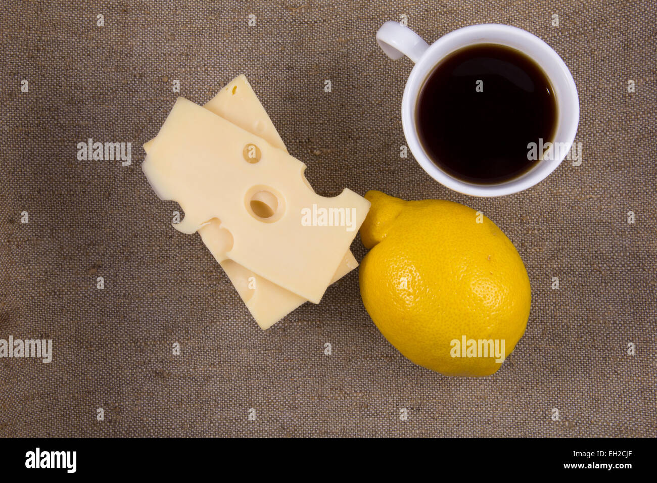 Cup of coffee with lemon and cheese on the burlap Stock Photo - Alamy