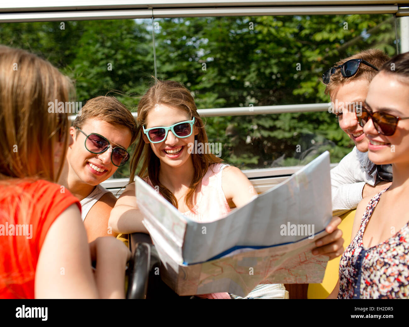 group of smiling friends traveling by tour bus Stock Photo - Alamy