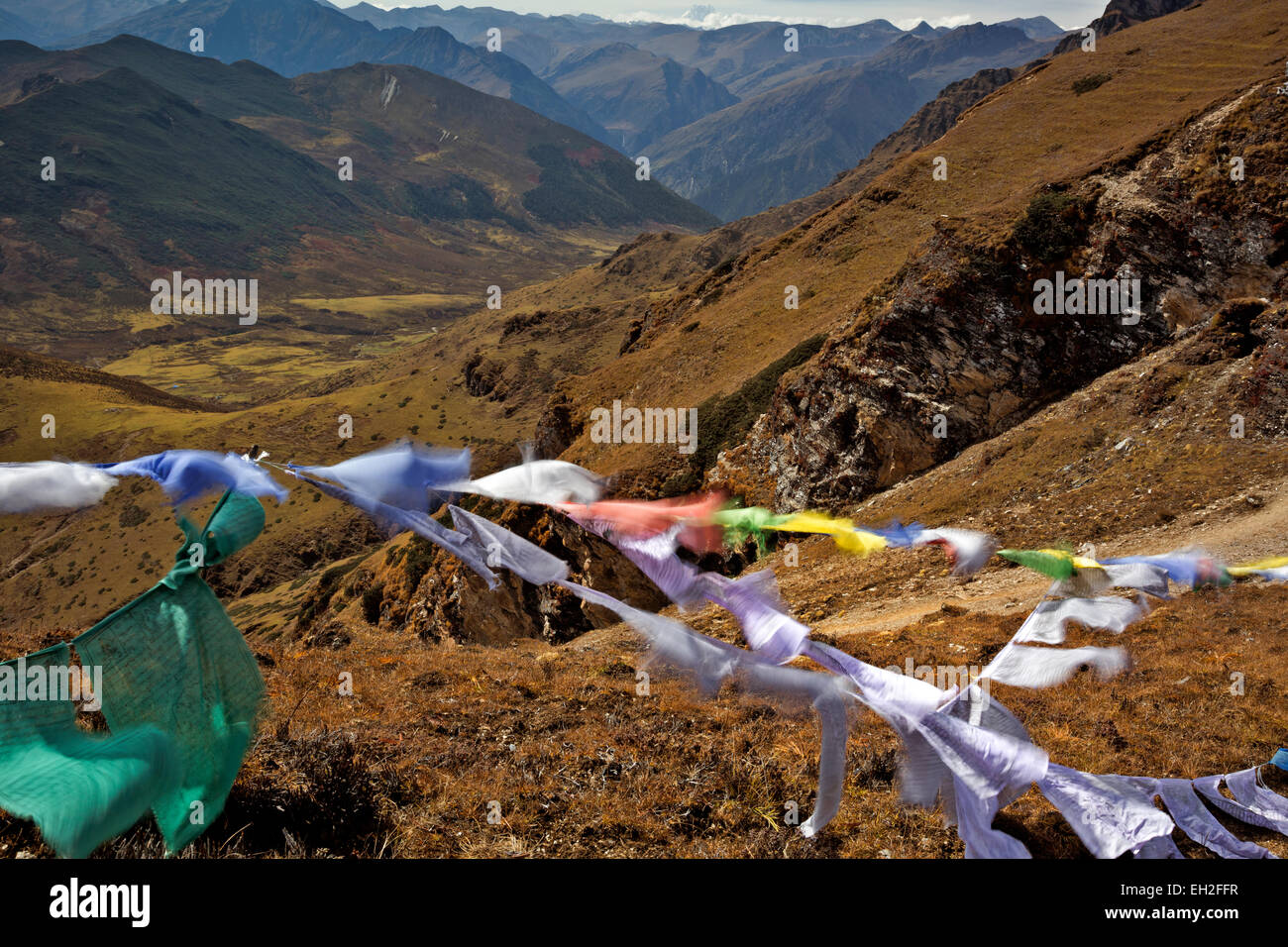 BU00257-00...BHUTAN - Prayer flags and the view south over Thombu Shong ...