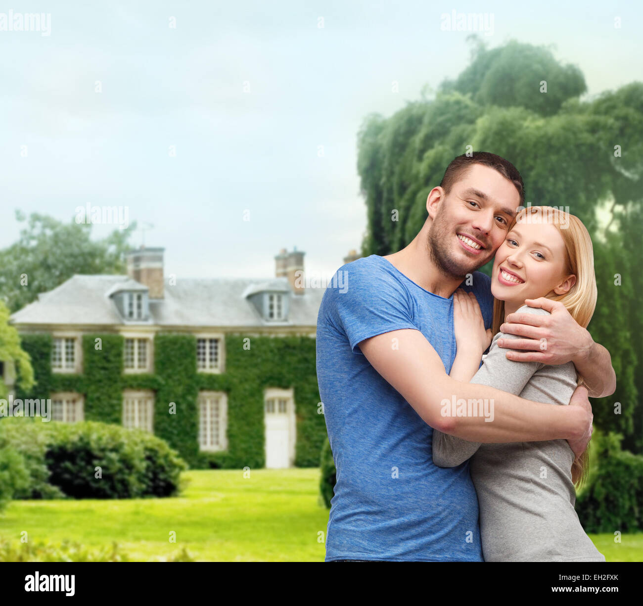 smiling couple hugging Stock Photo - Alamy