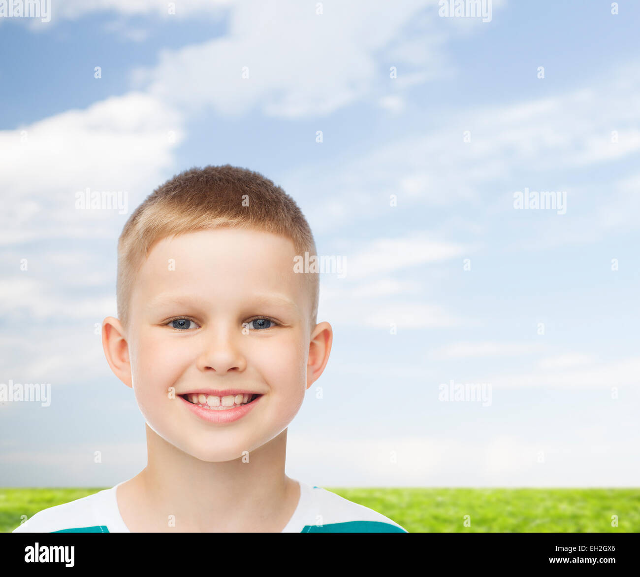 smiling little boy over natural background Stock Photo - Alamy