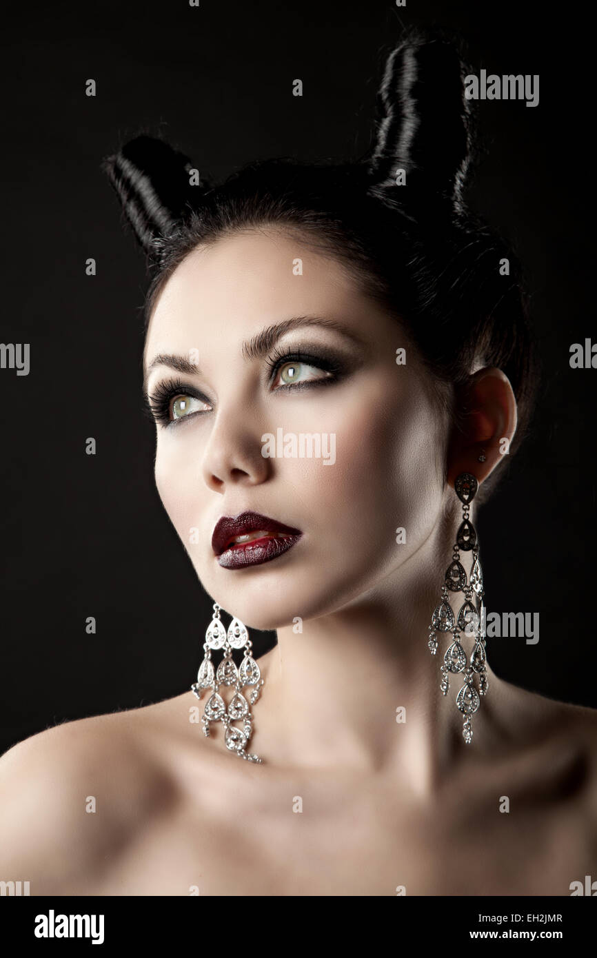 The girl in the image of the demon-tempter and hair in the form of ...