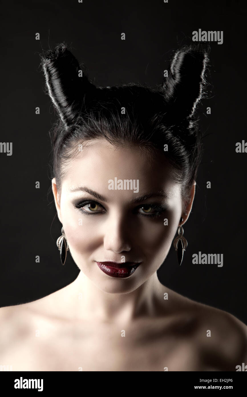 The girl in the image of the demon-tempter and hair in the form of ...