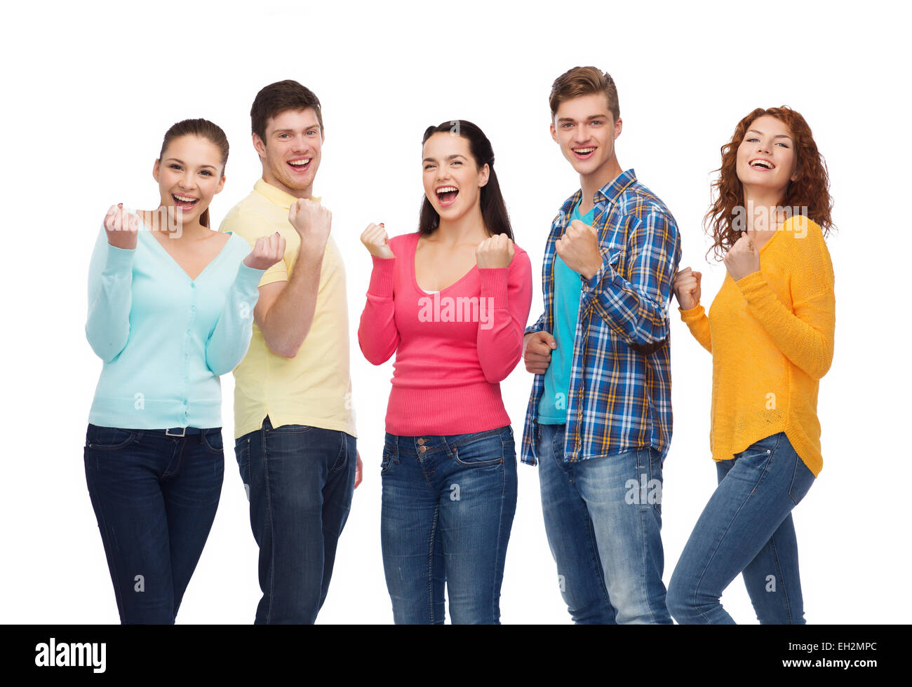 group of smiling teenagers showing triumph gesture Stock Photo - Alamy