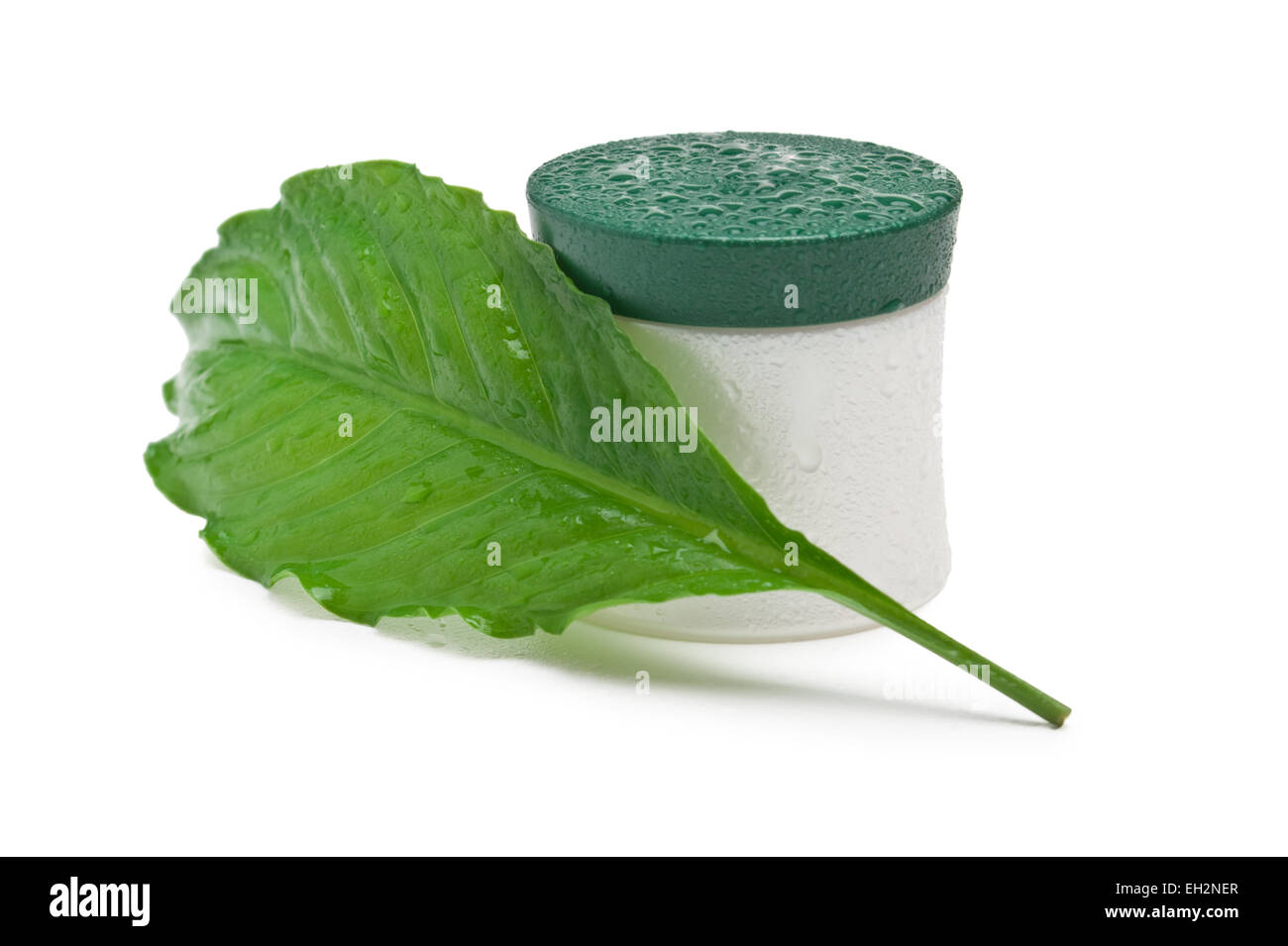 cosmetic cream and green leaf isolated on white backgrounds Stock Photo ...