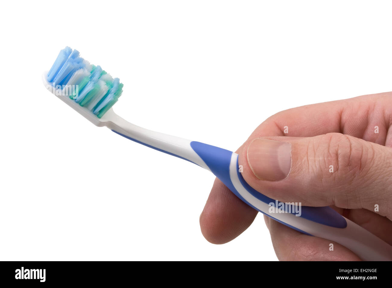 toothbrush in hand isolated on white background Stock Photo - Alamy