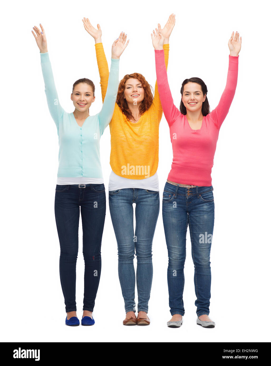 group of smiling teenagers with raised hands Stock Photo - Alamy