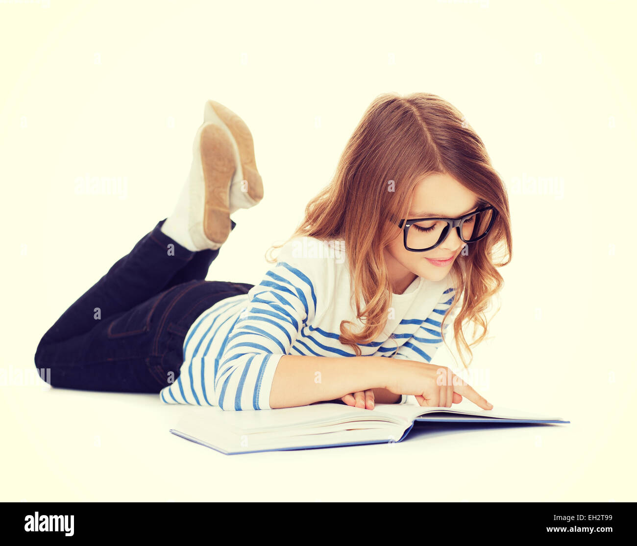 smiling little student girl lying on the floor Stock Photo - Alamy