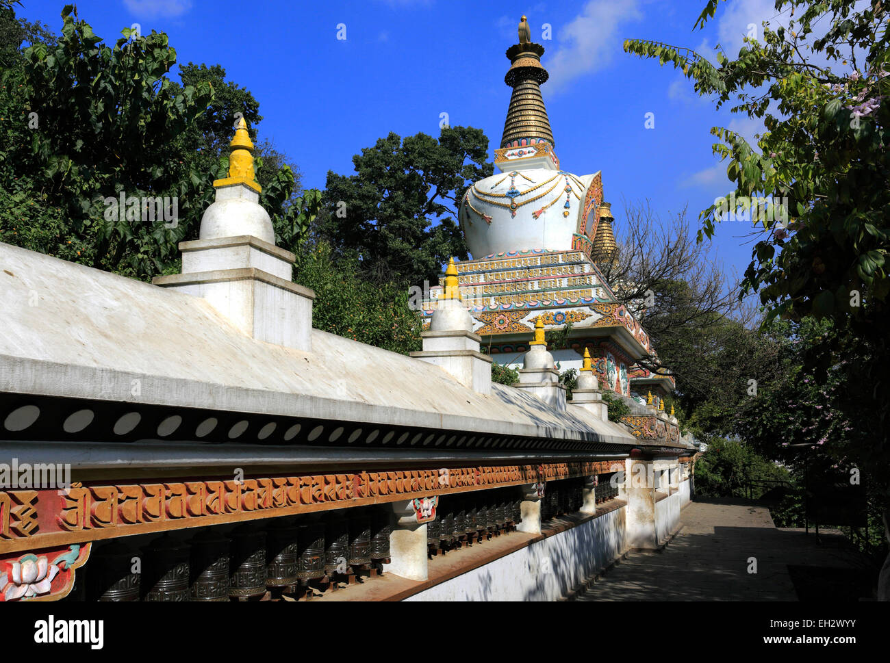 Part of the 245 foot long prayer wheel wall and Buddhist Stupas built ...