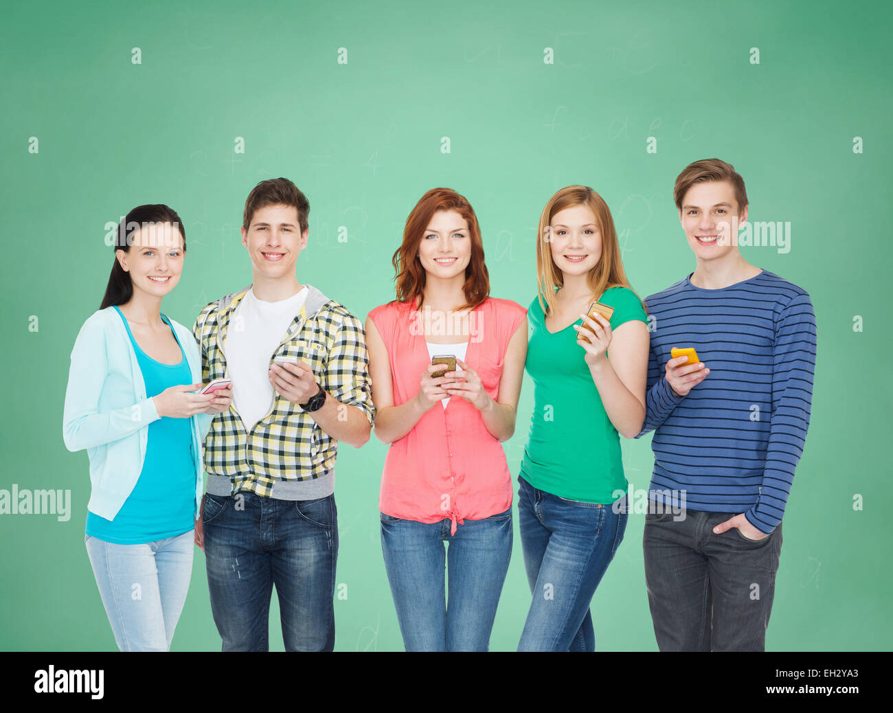 smiling students with smartphones Stock Photo - Alamy