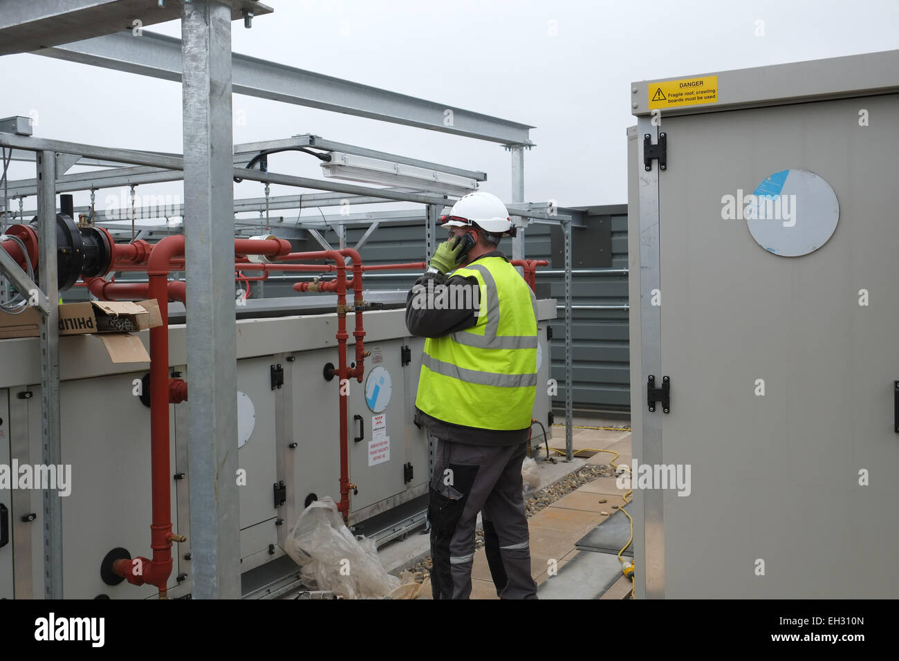 Construction contractors working on heating and electrical ...